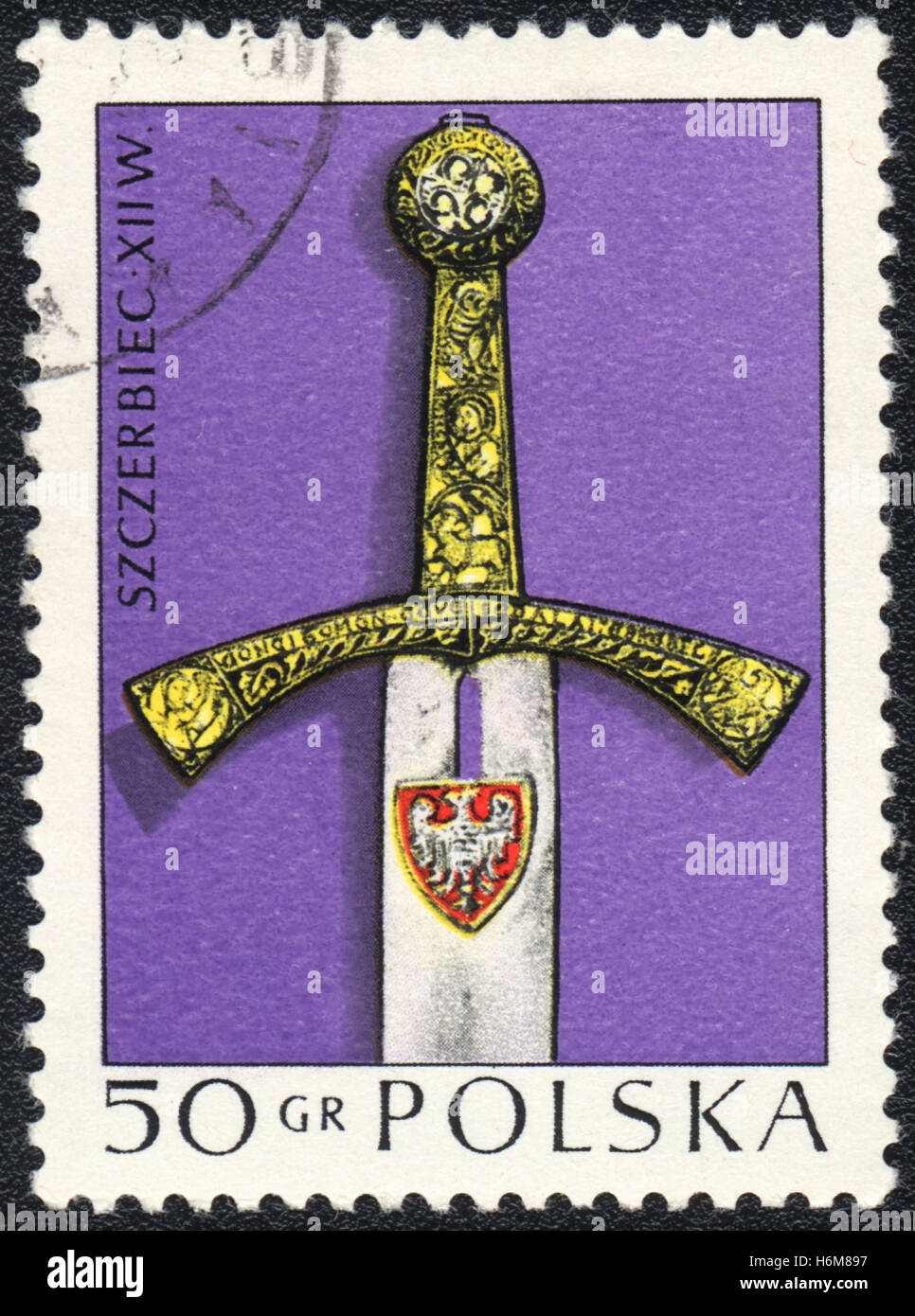 A postage stamp printed in Poland, shows Antique sword XII, circa 1973 ...