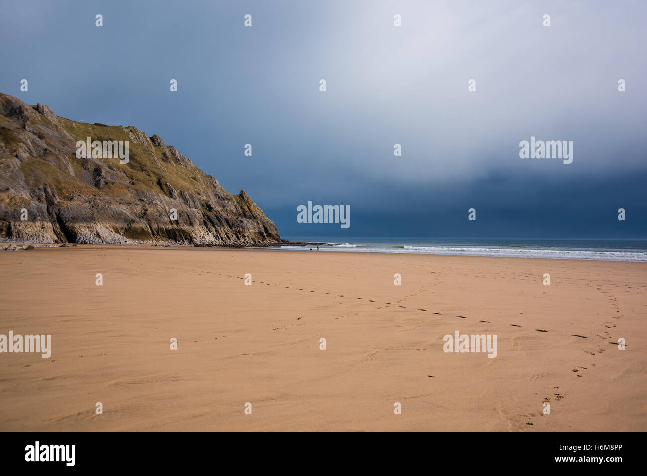 Distant storm over the North Devon coast seen from Pobbles Beach, Three ...