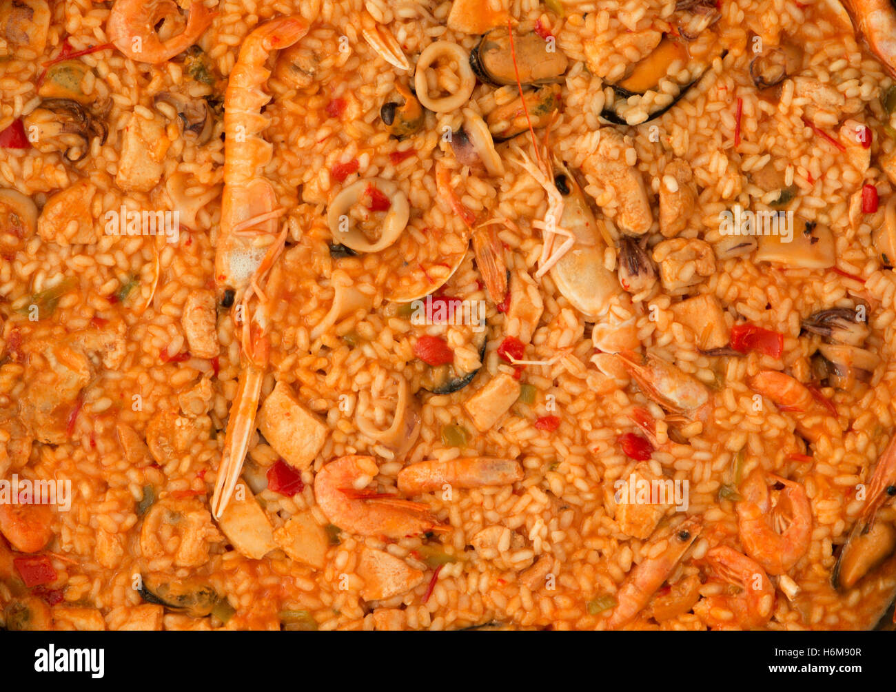 Spanish food. Seafood paella on a wooden blue background Stock Photo ...