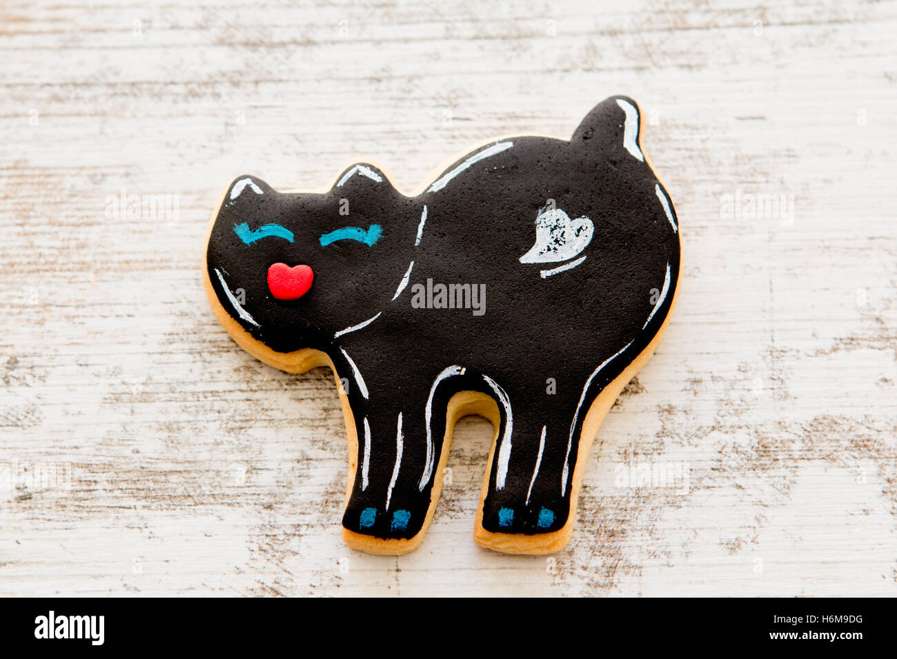 Halloween cookie with black cat shape. Sweet tradition Stock Photo - Alamy
