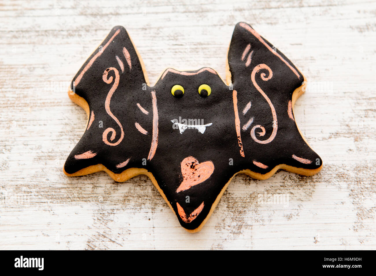 Halloween cookie with black bat shape. Sweet tradition Stock Photo - Alamy