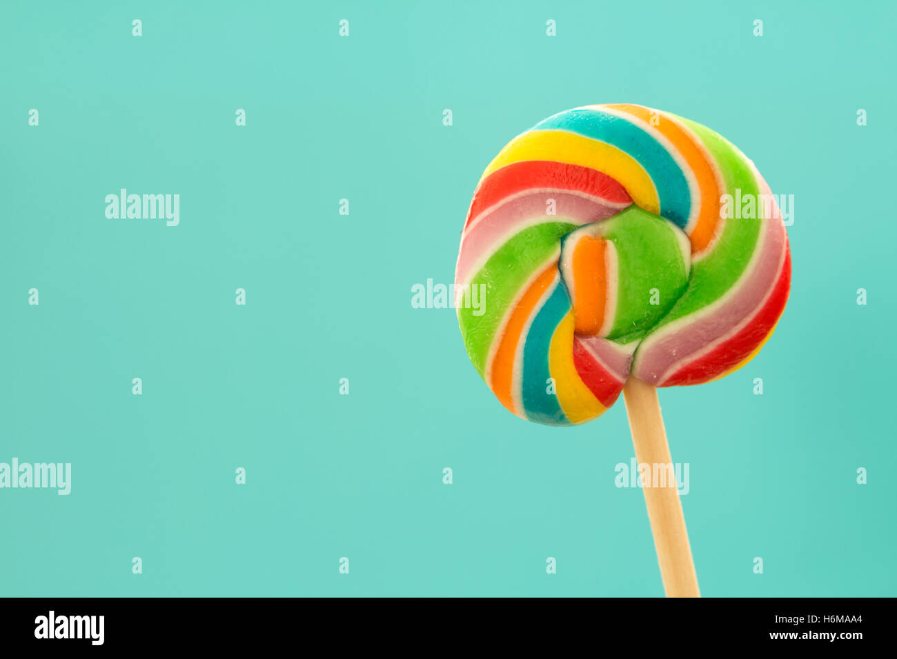 Nice lollipop with many colors in a spiral on a blue background Stock ...