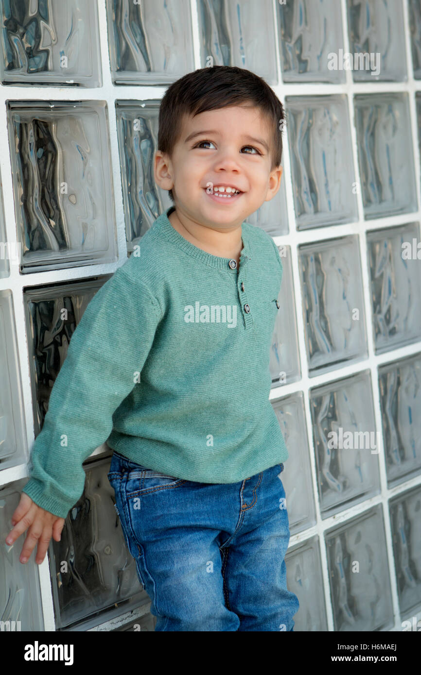 Cheerful child with two years making gestures on the street Stock Photo ...