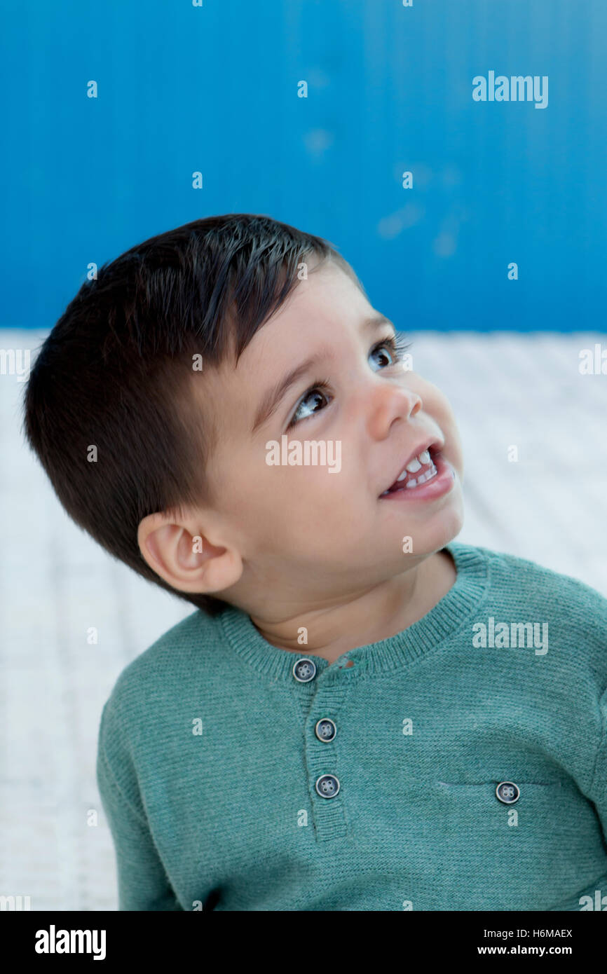 Cheerful child with two years making gestures on the street Stock Photo ...