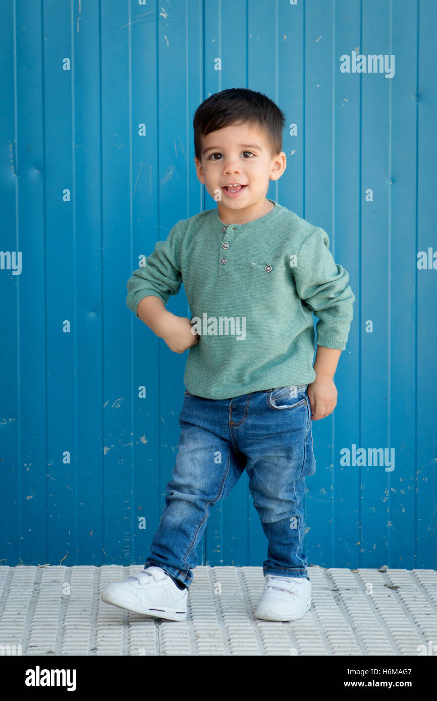 Cheerful child with two years making gestures on the street Stock Photo ...