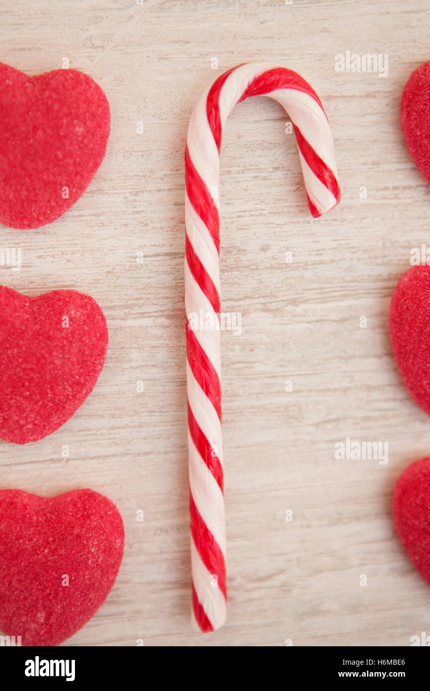 Candy canes and heart-shaped candies on a wooden grey background Stock ...