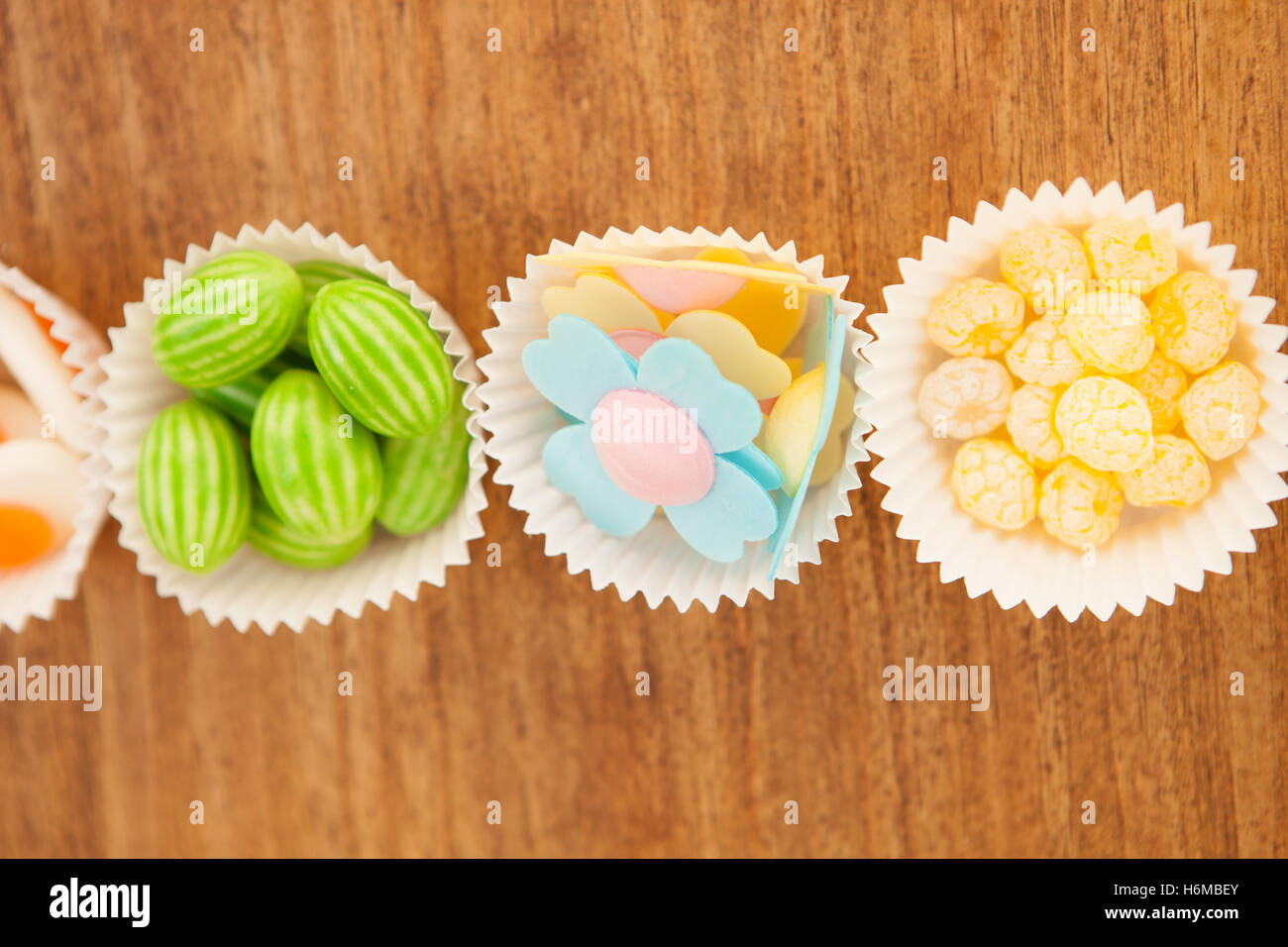 Types of candies placed in small bowls by type and color Stock Photo ...