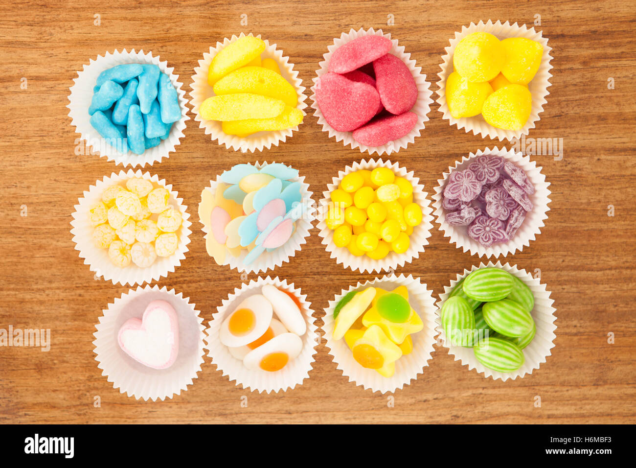 Many types of candies placed in small bowls by type and color Stock ...