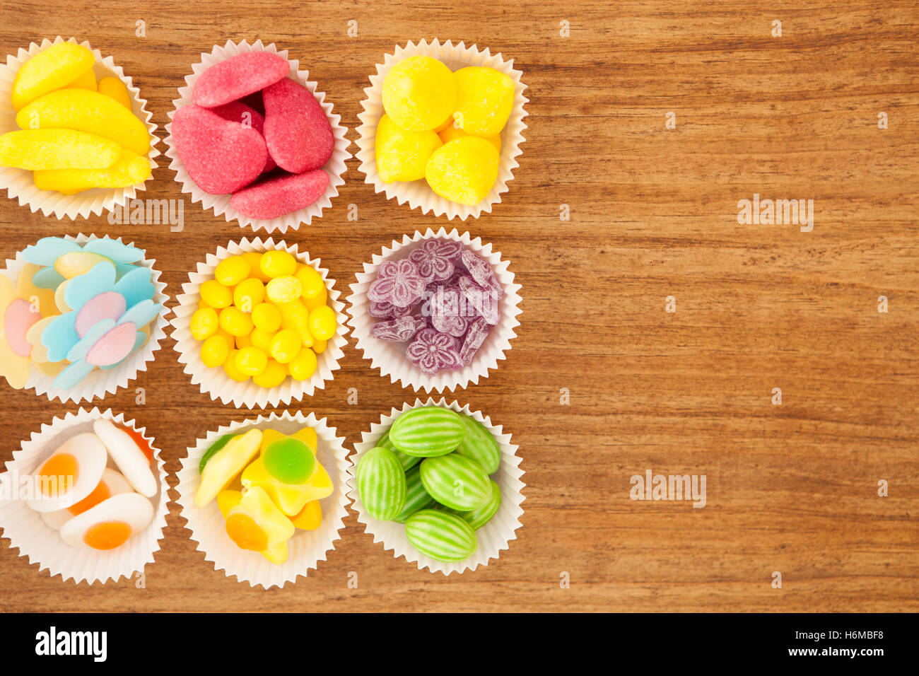 Many types of candies placed in small bowls by type and color Stock ...