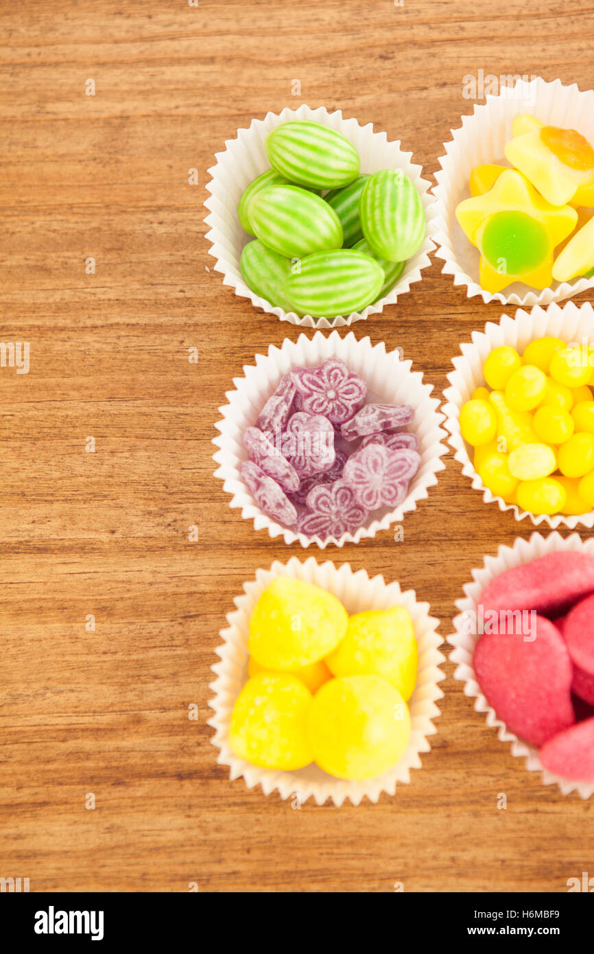 Many types of candies placed in small bowls by type and color Stock ...