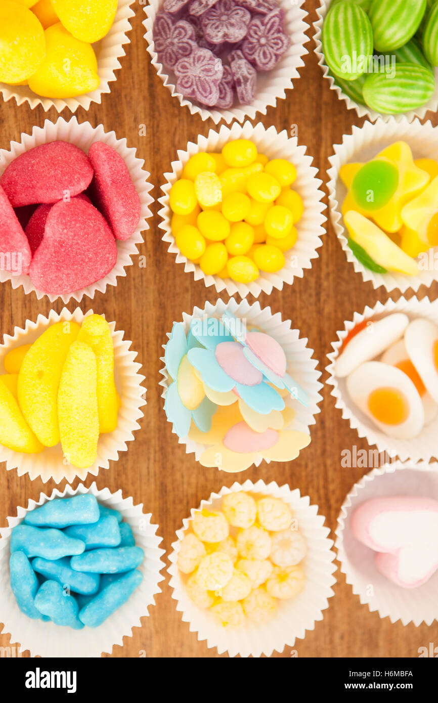 Many types of candies placed in small bowls by type and color Stock ...