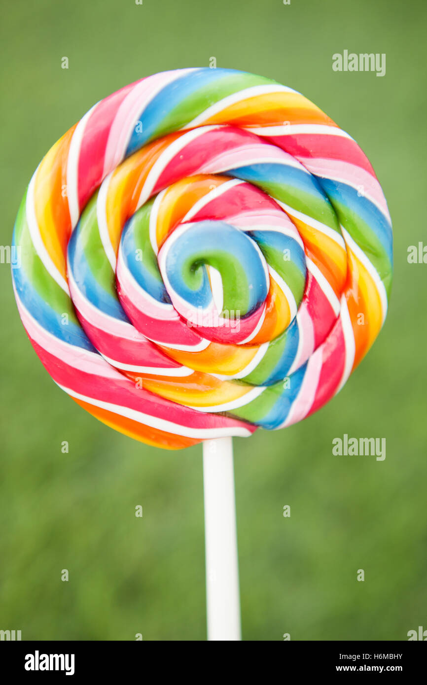 Nice round lollipop with many colors in a spiral Stock Photo - Alamy
