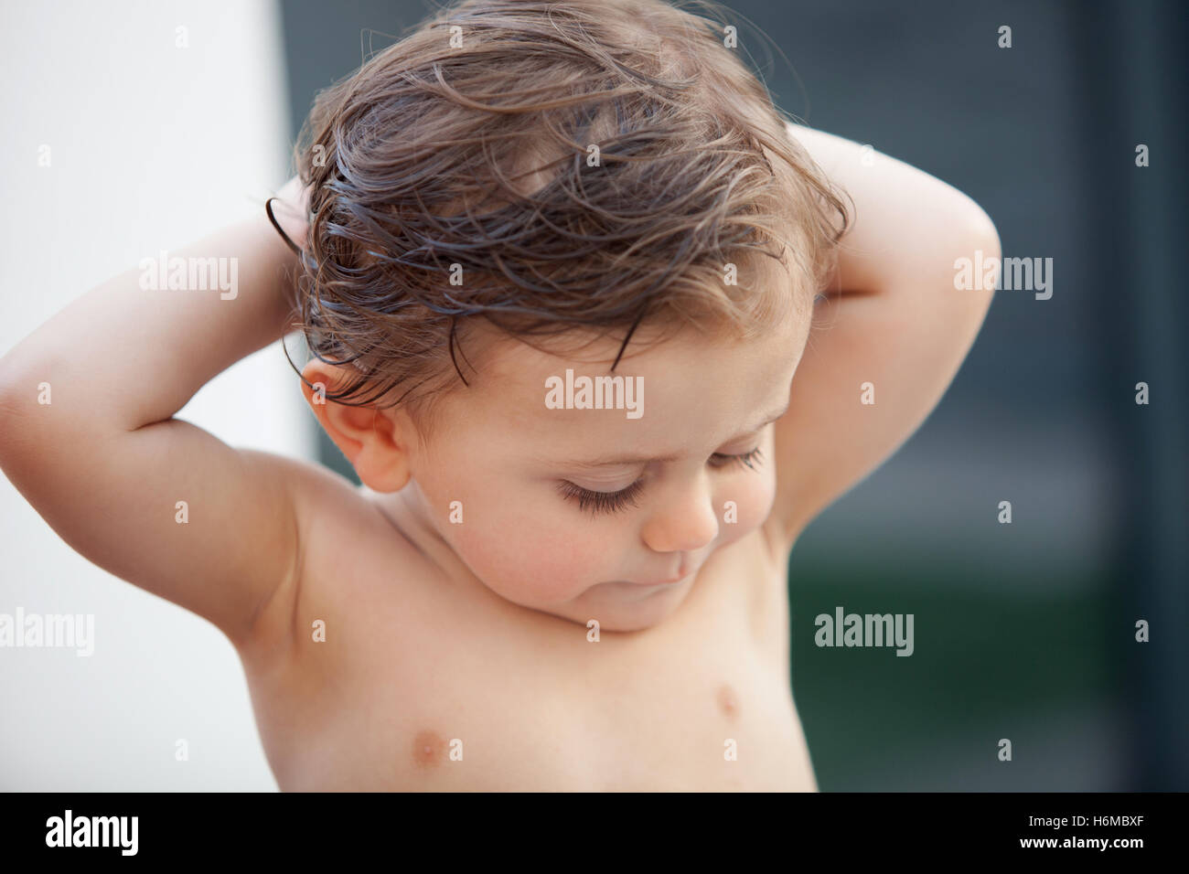 Beautiful baby one years old outside with wet hair Stock Photo - Alamy