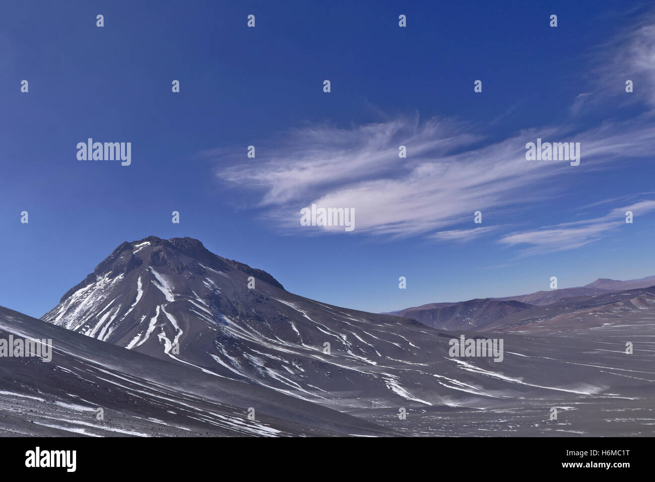 Acamarachi volcano covered with snow in the early morning Stock Photo ...