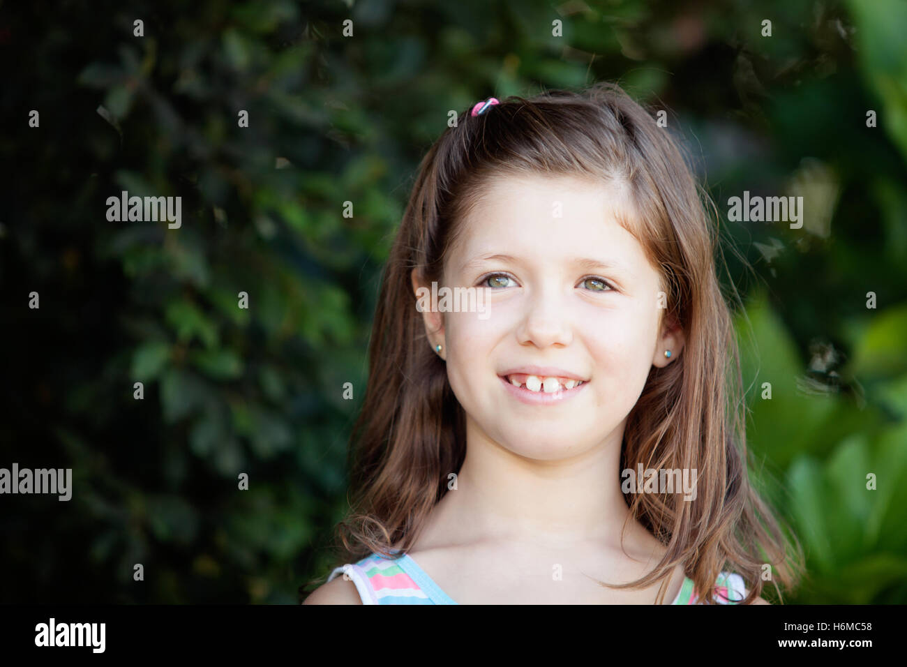 Pretty eight year old girl with blue eyes in the park Stock Photo - Alamy