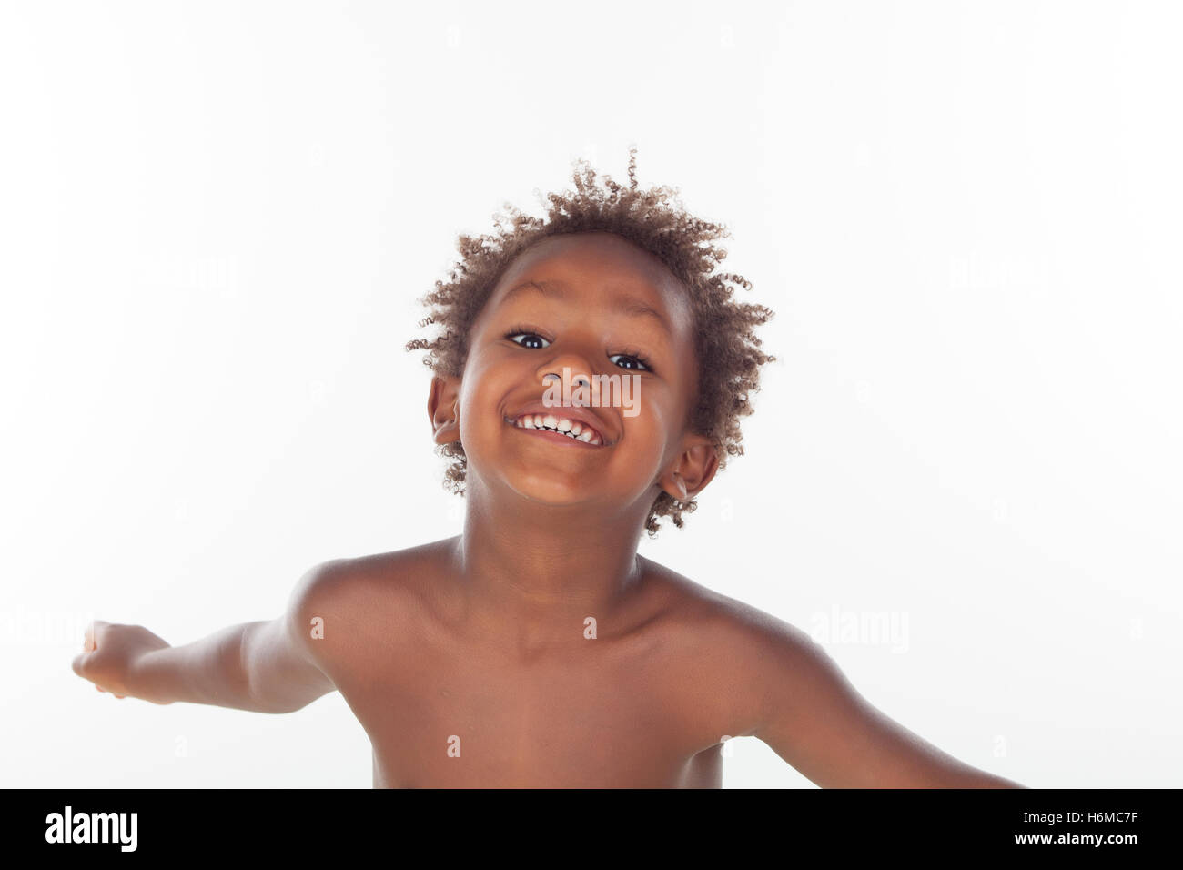 African child making funny faces isolated on white background Stock ...