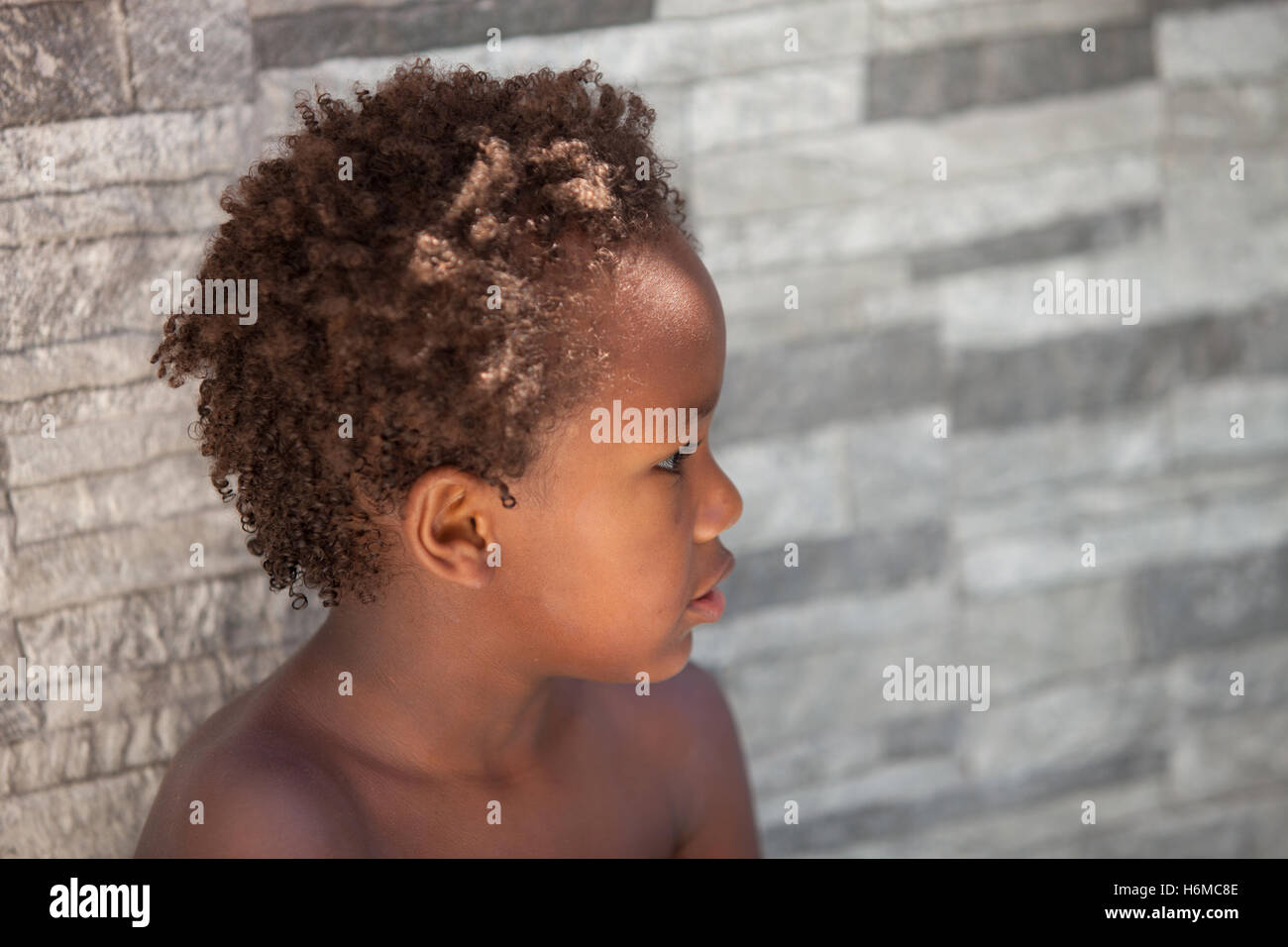 African little kid three years without a shirt on a summer day Stock ...