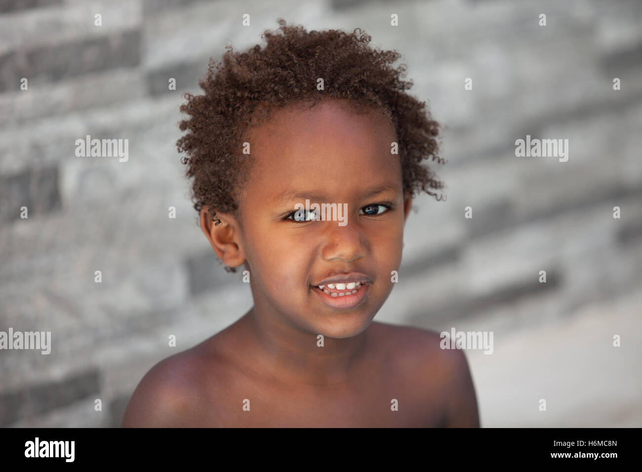 African little kid three years without a shirt on a summer day Stock ...