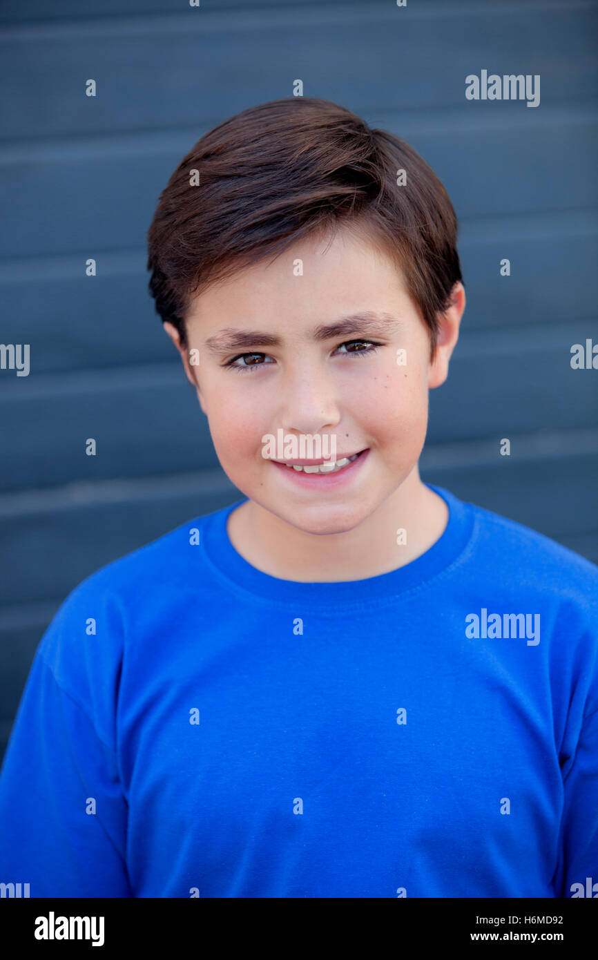 Funny child with ten years old with blue t-shirt outside Stock Photo ...