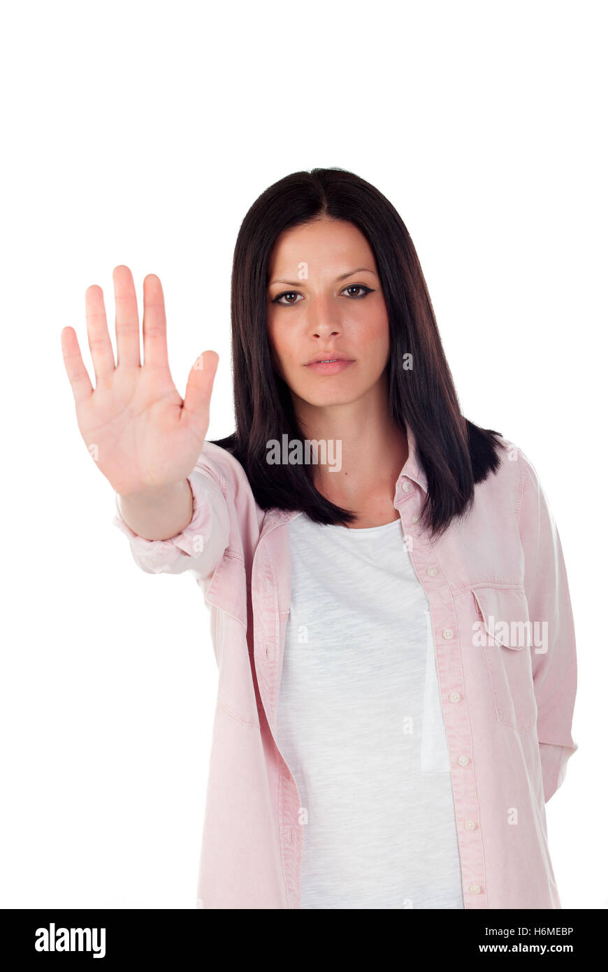 Young brunette girl making stop sign on a white background Stock Photo ...