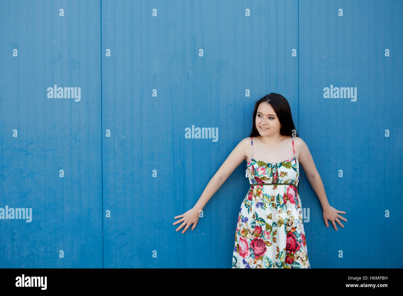 Teenage girl with a blue background on the outside Stock Photo - Alamy