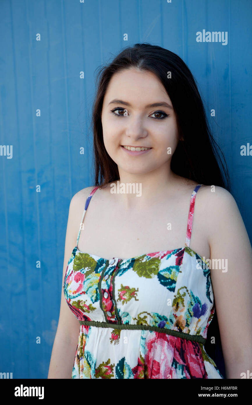 Teenage girl with a blue background on the outside Stock Photo - Alamy