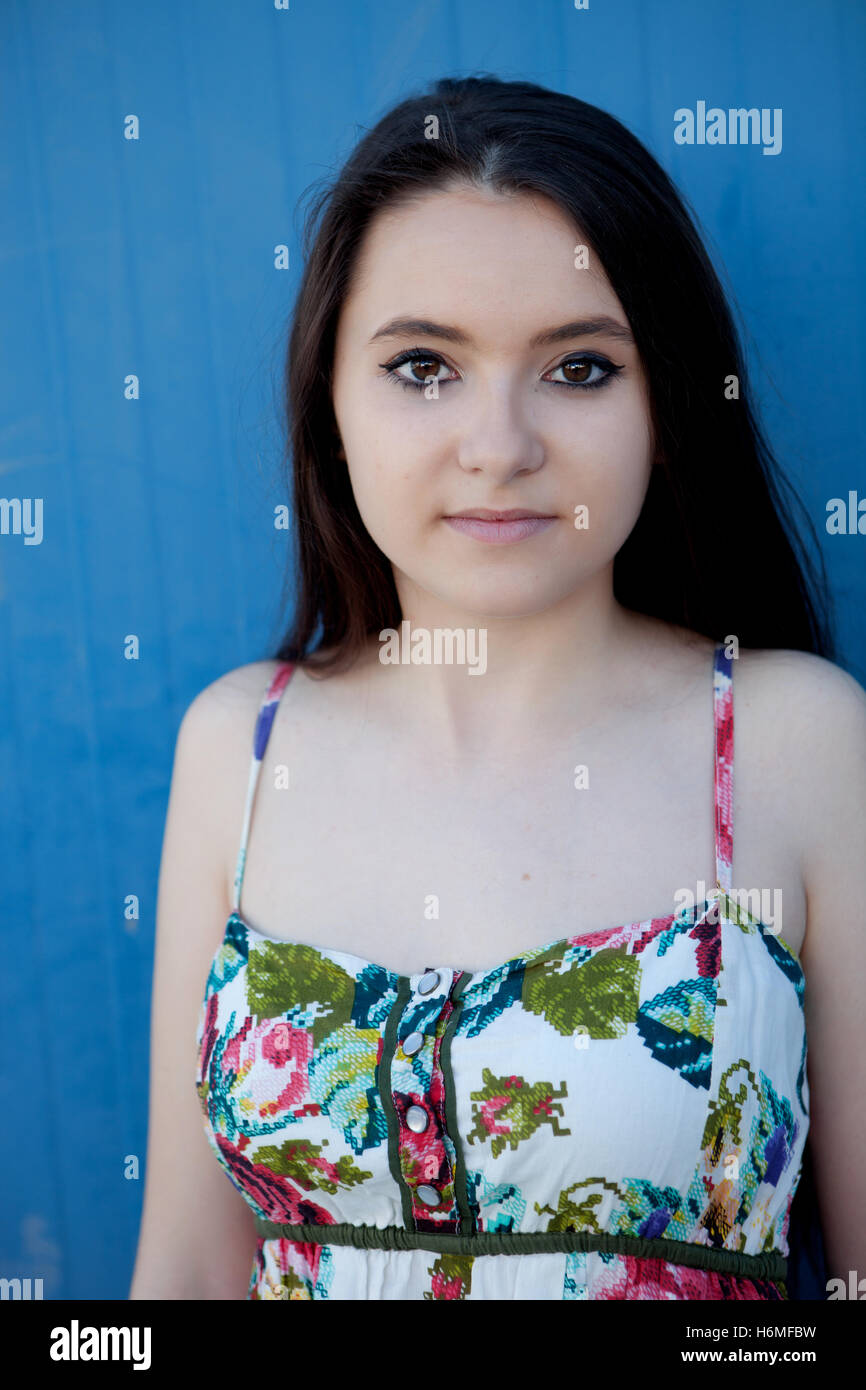 Teenage girl with a blue background on the outside Stock Photo - Alamy