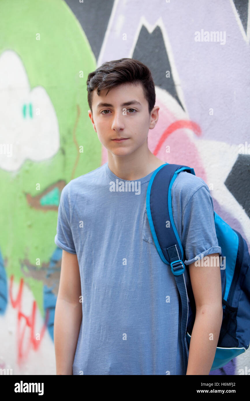 Rebel student with a background wall graffiti losing classes Stock ...