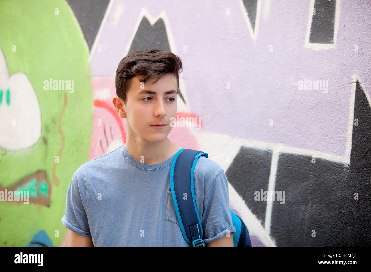 Rebel student with a background wall graffiti losing classes Stock ...