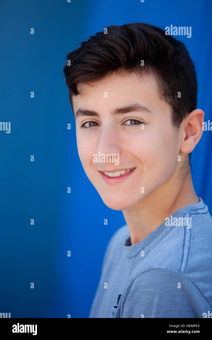 Portrait of a teenager rebellious man with a blue background Stock ...