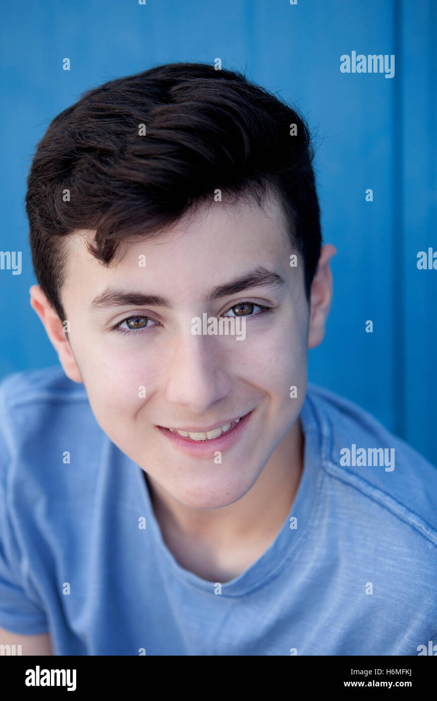 Portrait of a teenager rebellious man with a blue background Stock ...