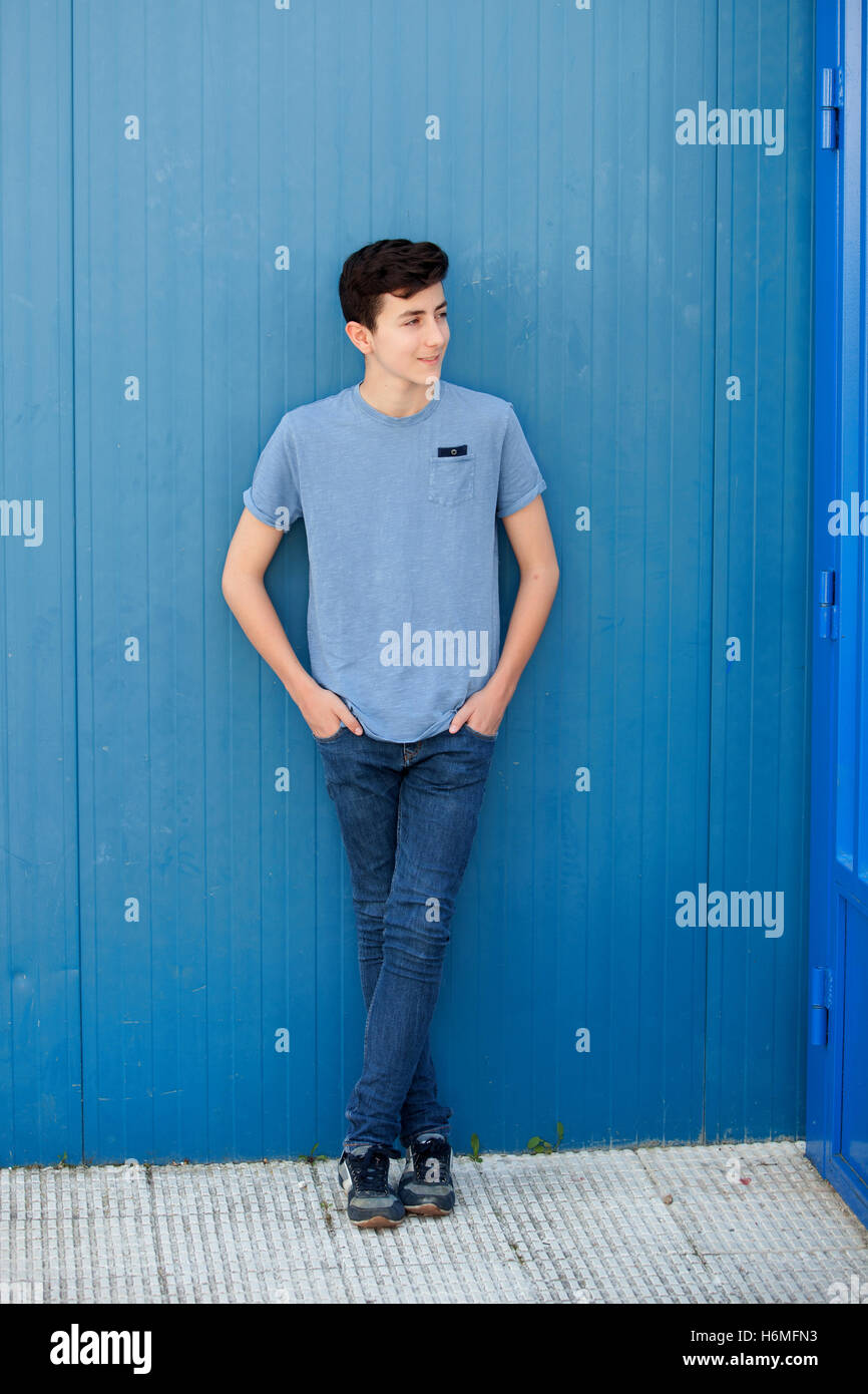 Portrait of a teenager rebellious man with a blue background Stock ...