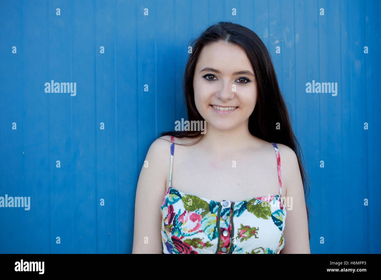 Teenage girl with a blue background on the outside Stock Photo - Alamy