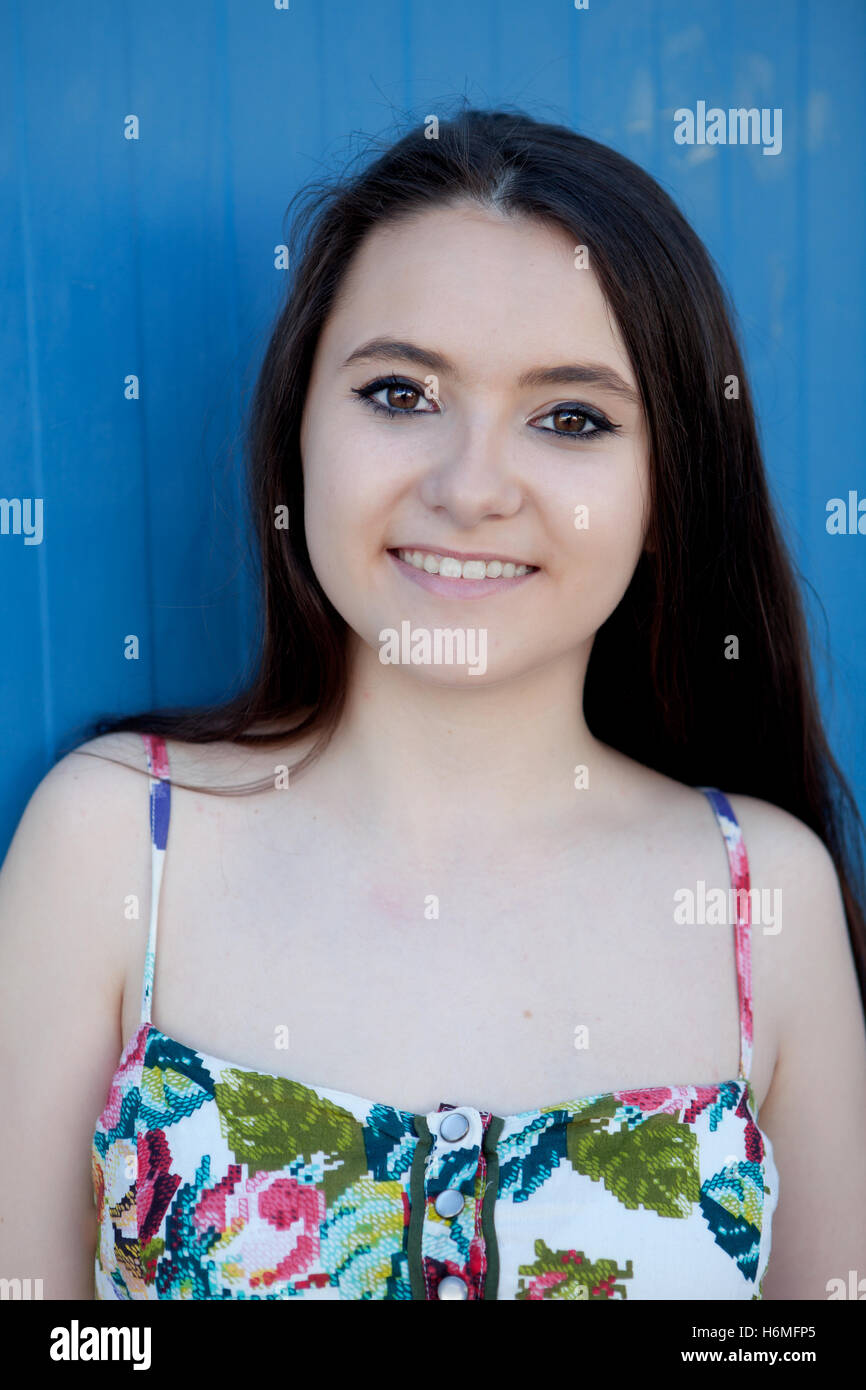 Teenage girl with a blue background on the outside Stock Photo - Alamy