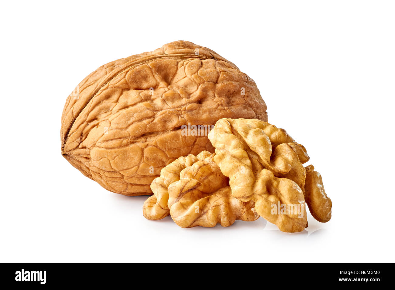 Kernel and whole walnut on white Stock Photo - Alamy