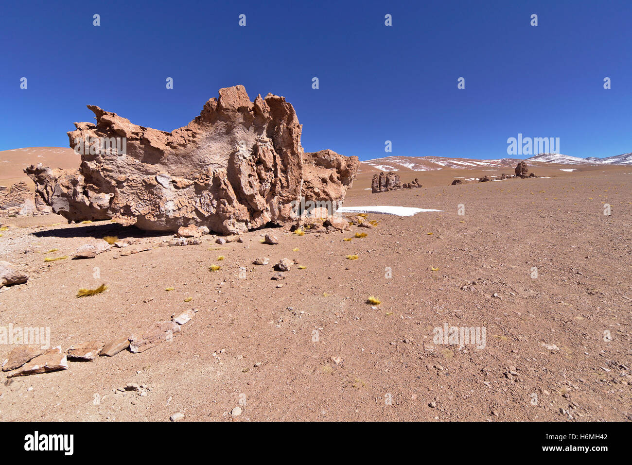 Erosion sculpted red rocks in the desert under a beautiful clean sky ...