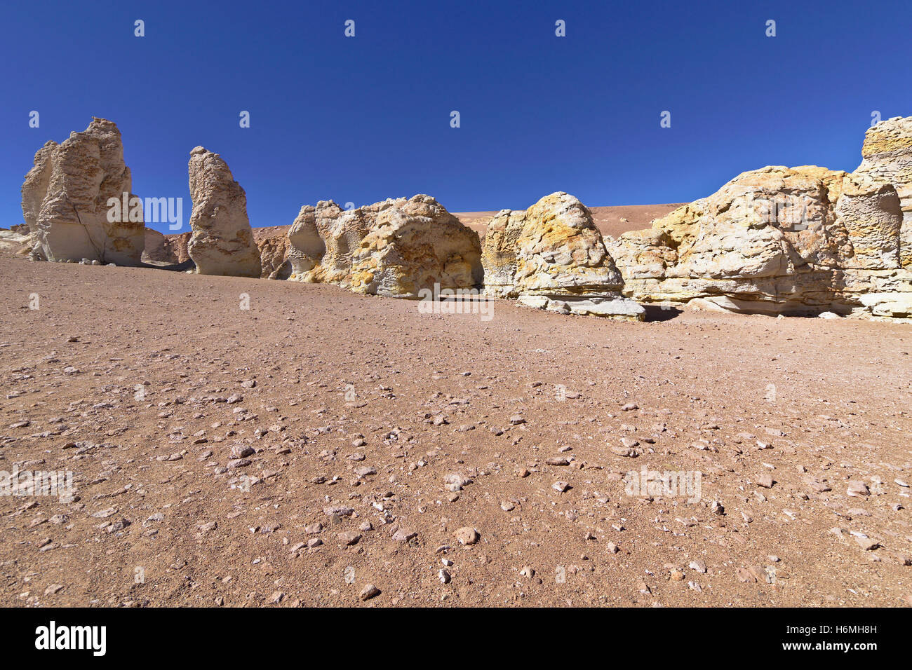 Yellow rock formations in a desert landscape Stock Photo - Alamy
