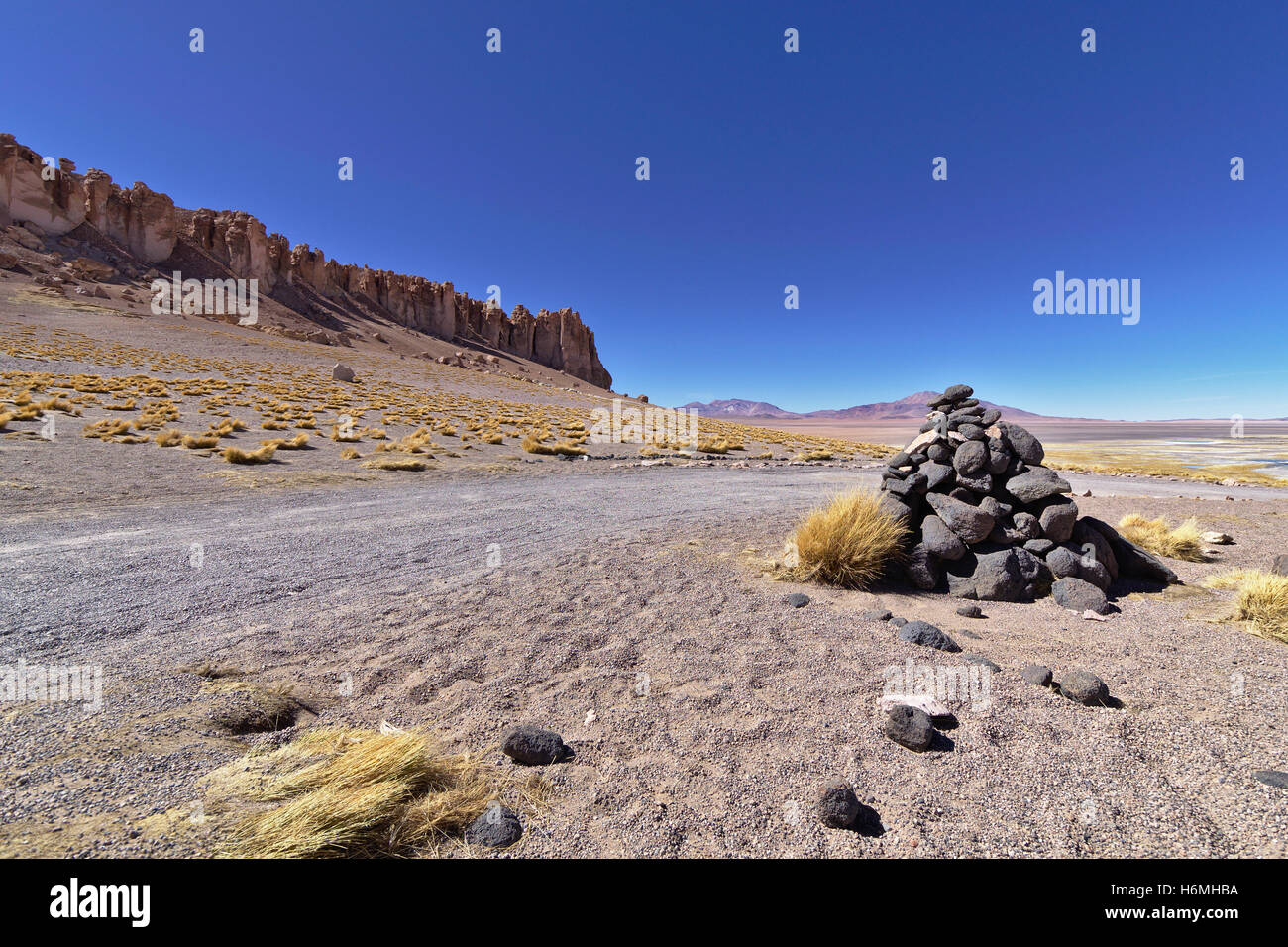 Pile of rocks forming a pyramid in the middle of the Atacama desert ...