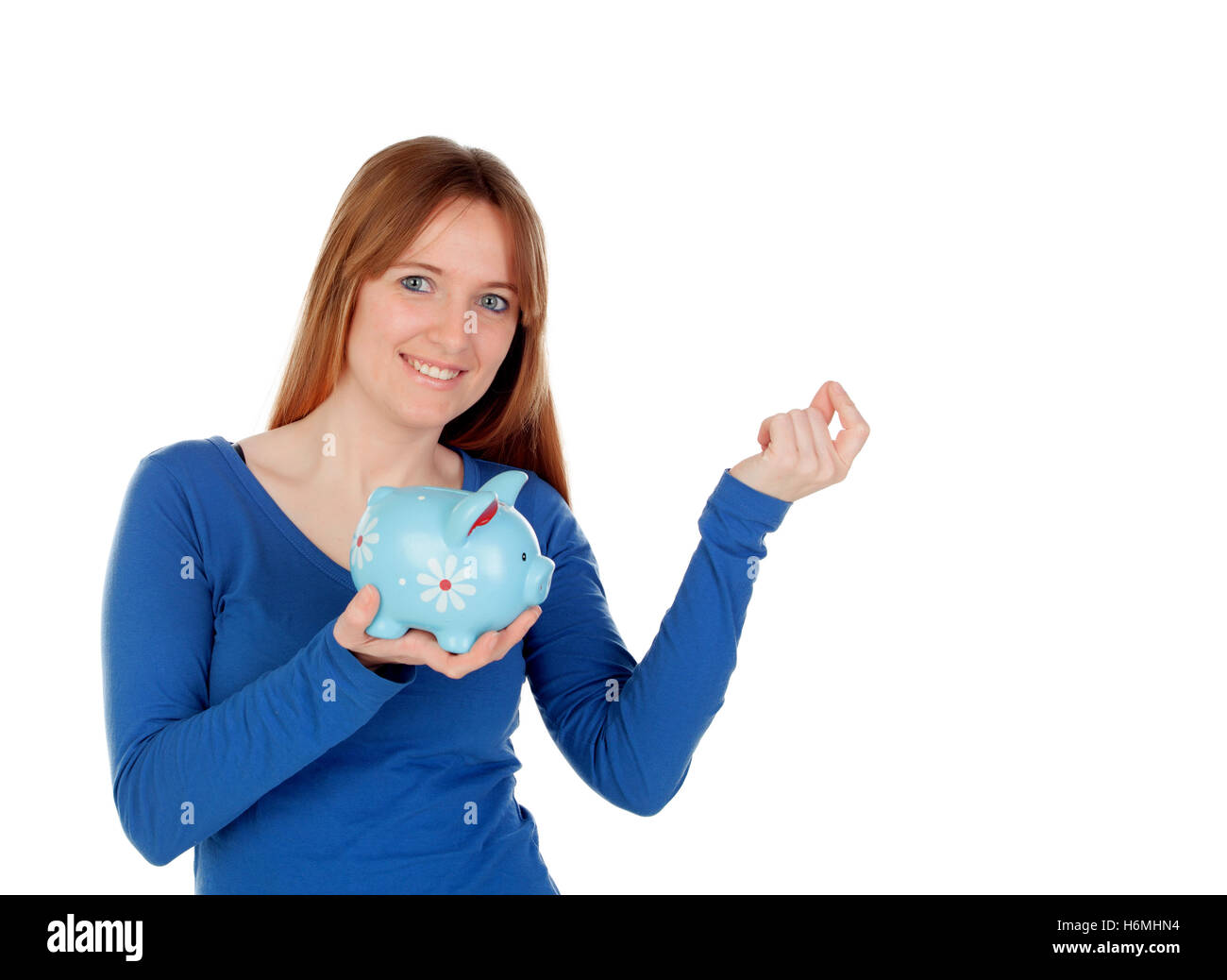 Happy young woman with a blue money box isolated on a white background ...