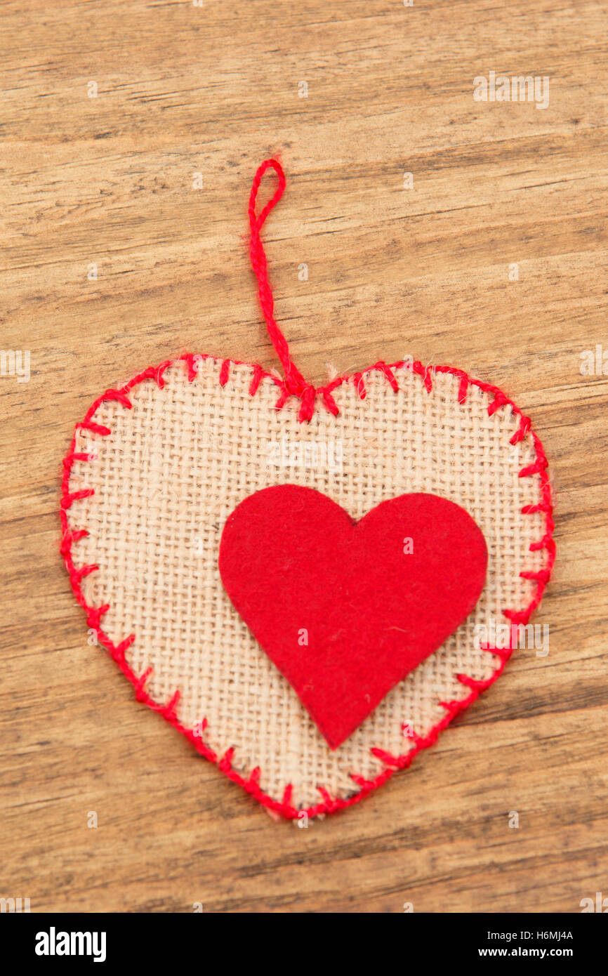 Valentine hearts on rustic wooden background Stock Photo - Alamy