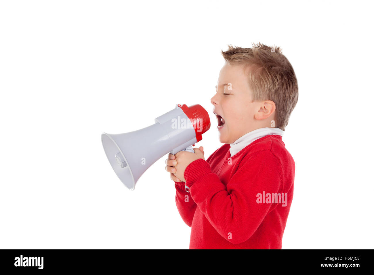 Small boy shouting through a megaphone isolated on white background ...