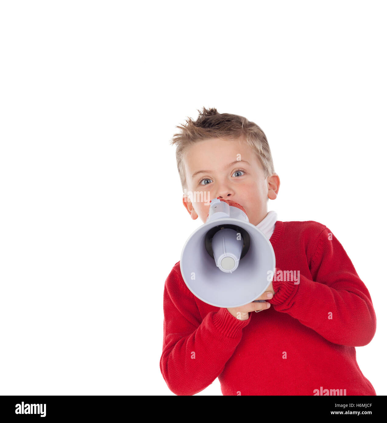 Small boy shouting through a megaphone isolated on white background ...