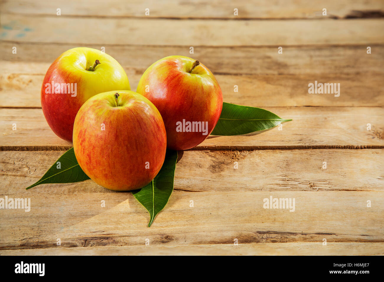 red apple on wood background texture with space for text Stock Photo ...
