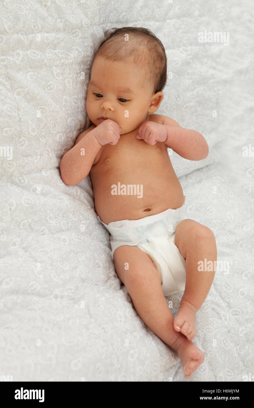 Beautiful baby in diaper with open eyed Stock Photo - Alamy
