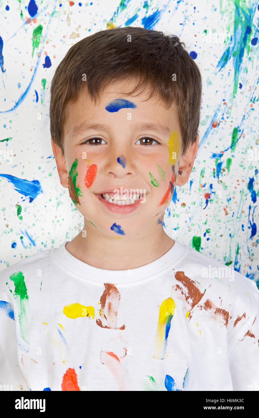 Happy and painted child stained paint Stock Photo - Alamy