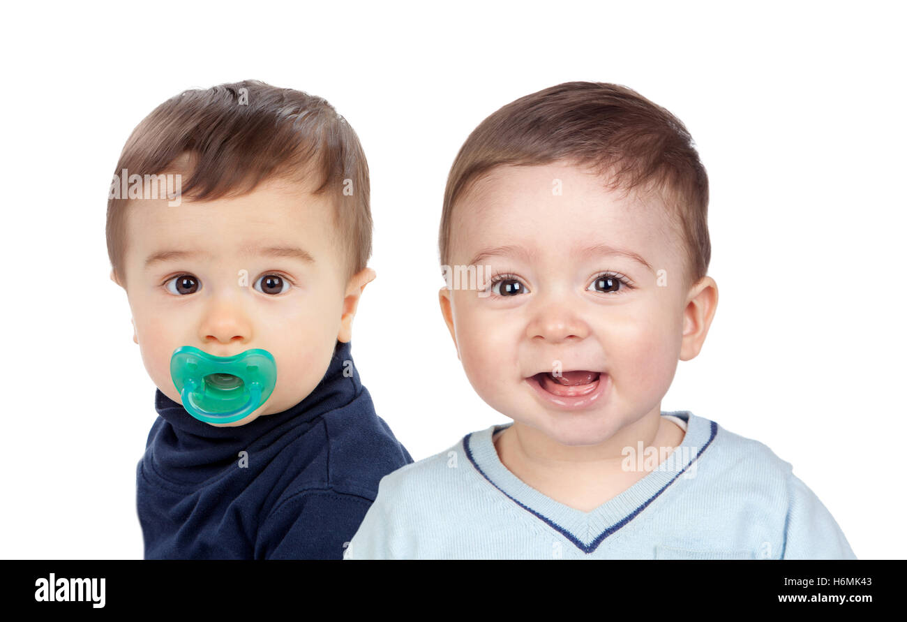 Two beautiful children looking at camera isolated on a white background ...