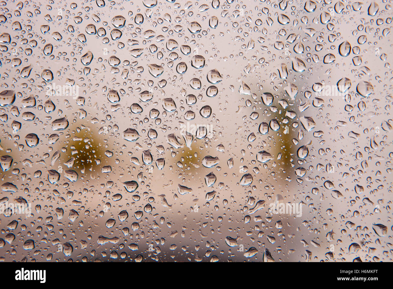 Wet glass with drops of rain fall on the street Stock Photo - Alamy