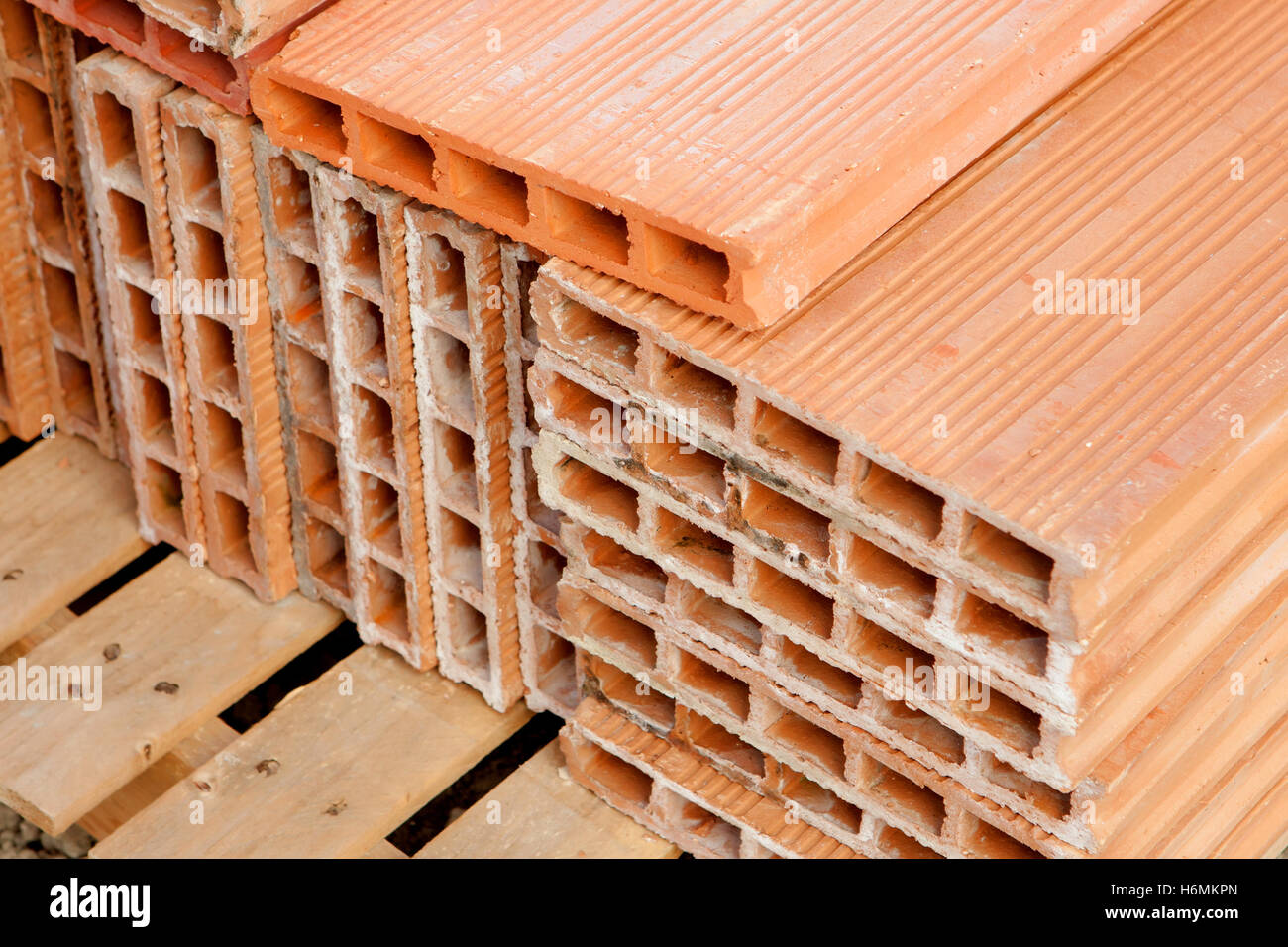 Red bricks stacked. Material prepared for the construction Stock Photo ...
