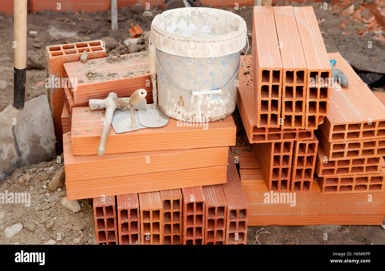 Brick and construction tools in the work Stock Photo - Alamy