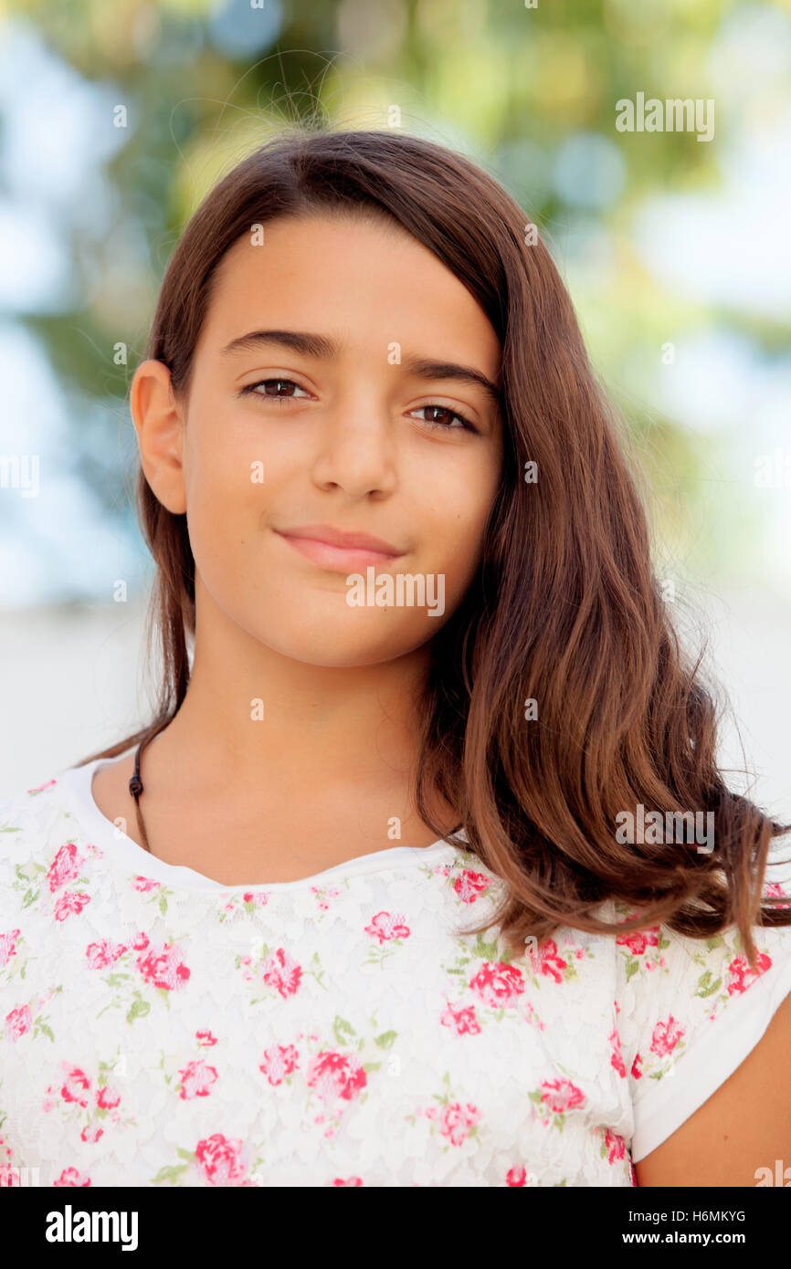 Nice child girl ten year old smiling at camera on the street Stock ...